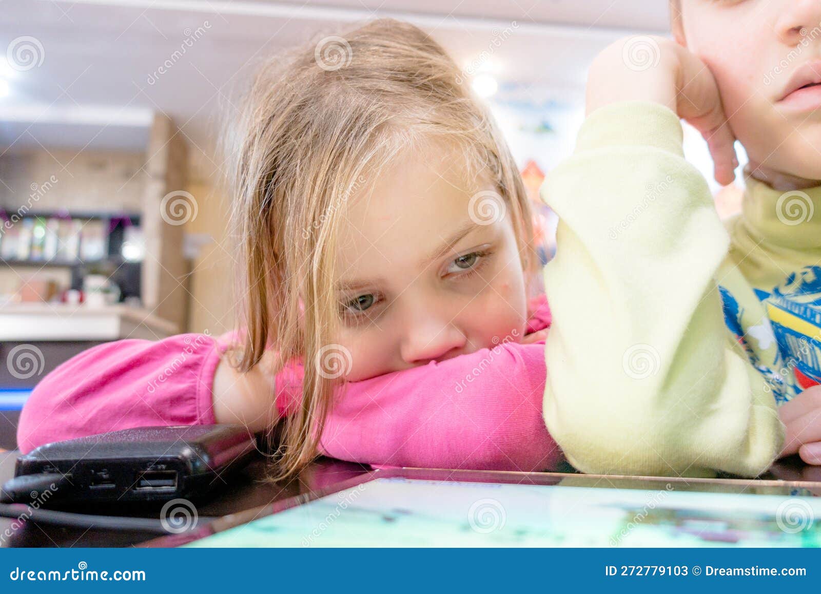 Girl Sitting at the Table Listening Attentively Stock Image - Image of ...