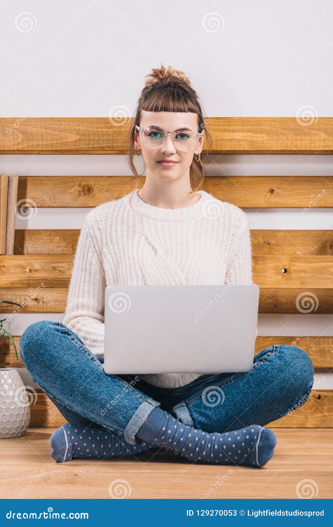 Girl Sitting on Table in Office with Laptop and Looking Stock Image ...