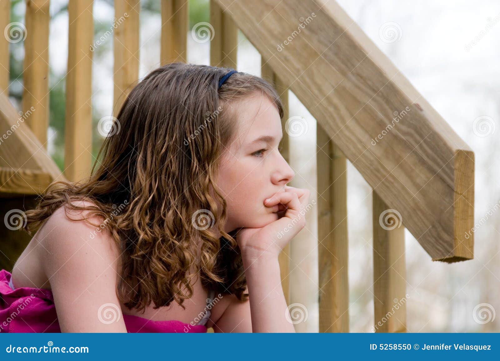 A Girl Sitting and Thinking Stock Photo - Image of contemplating, hands ...