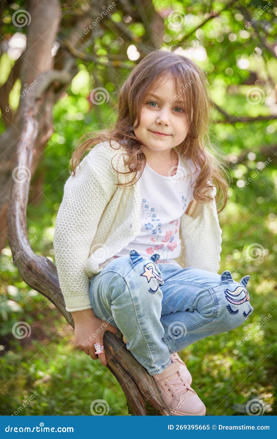 A Girl is Sitting on a Tree on a Sunny Summer Day. Stock Image - Image ...
