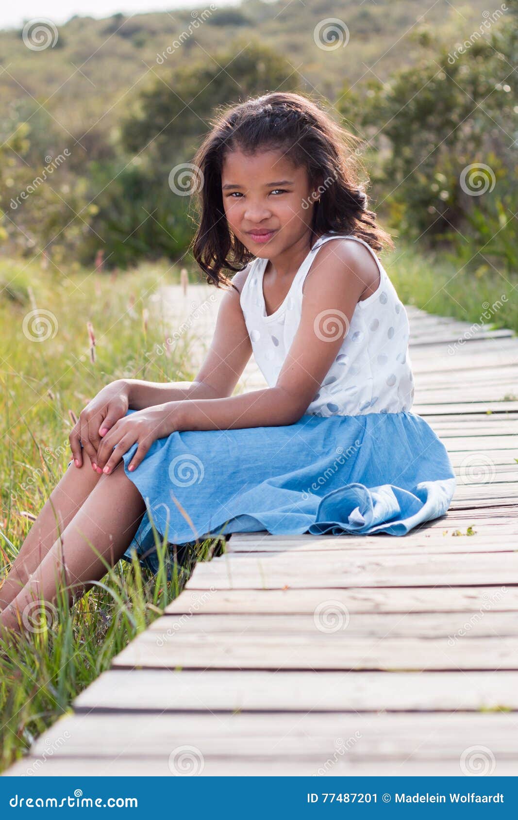 Girl sitting on walkway stock image. Image of female - 77487201