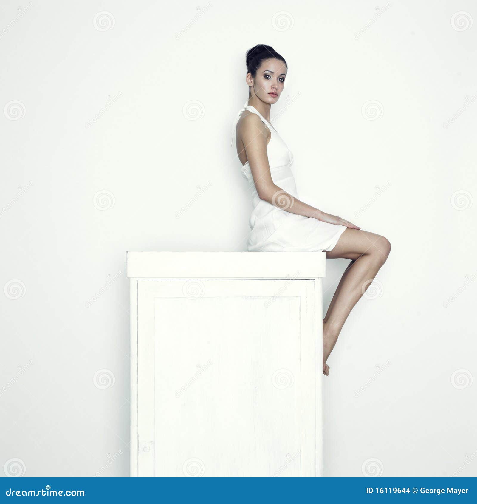 Girl Sitting on the Wardrobe Stock Photo - Image of expressions ...