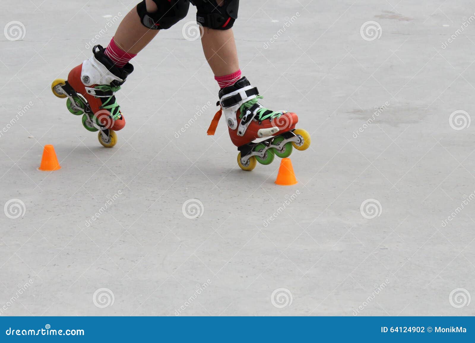 Girl skating in two wheels stock photo. Image of orange - 64124902