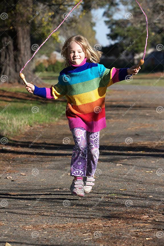 Girl skipping stock image. Image of sunlight, park, lifestyle - 17018757
