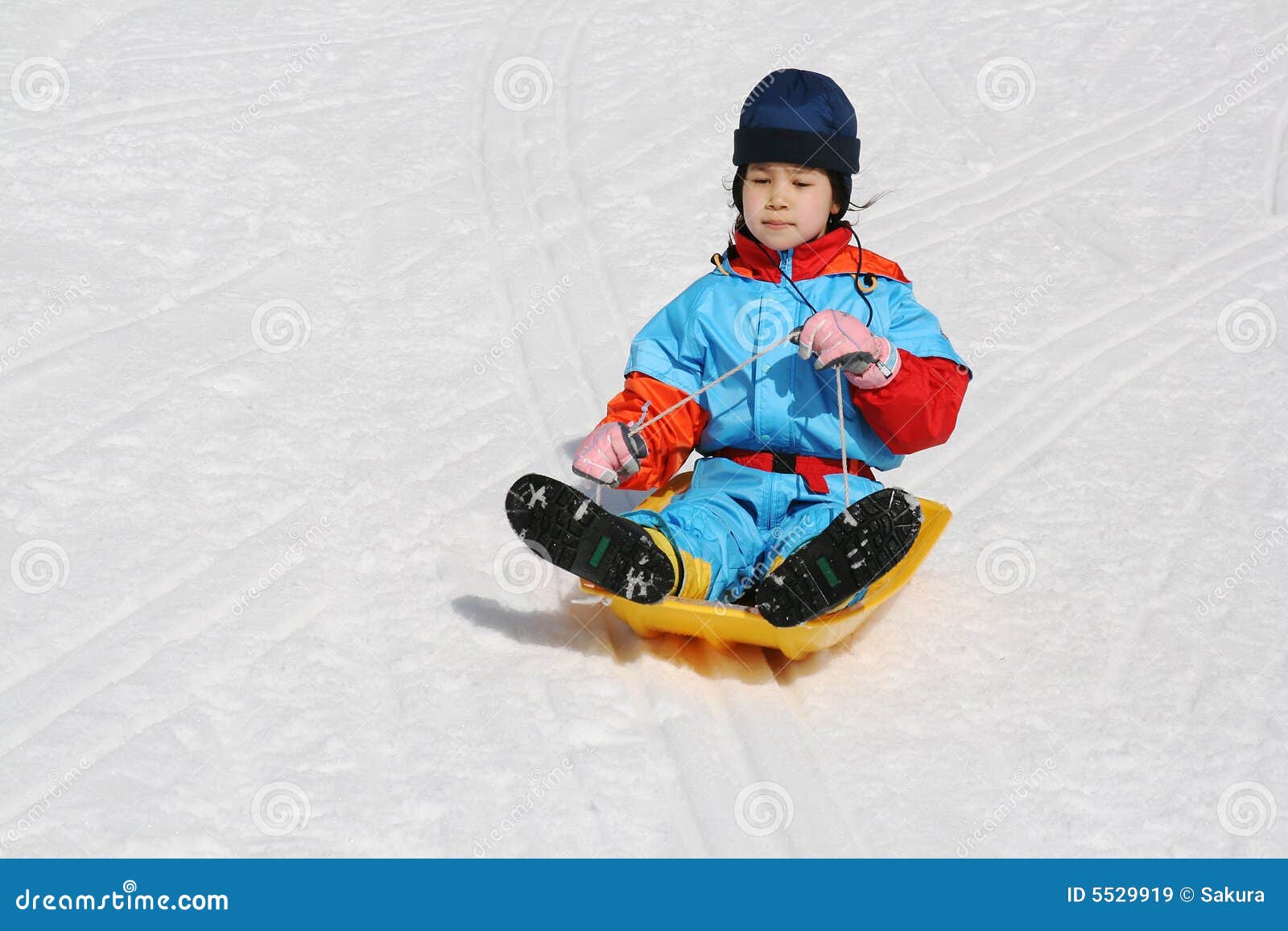 Girl sleding from hill stock image. Image of elementary - 5529919