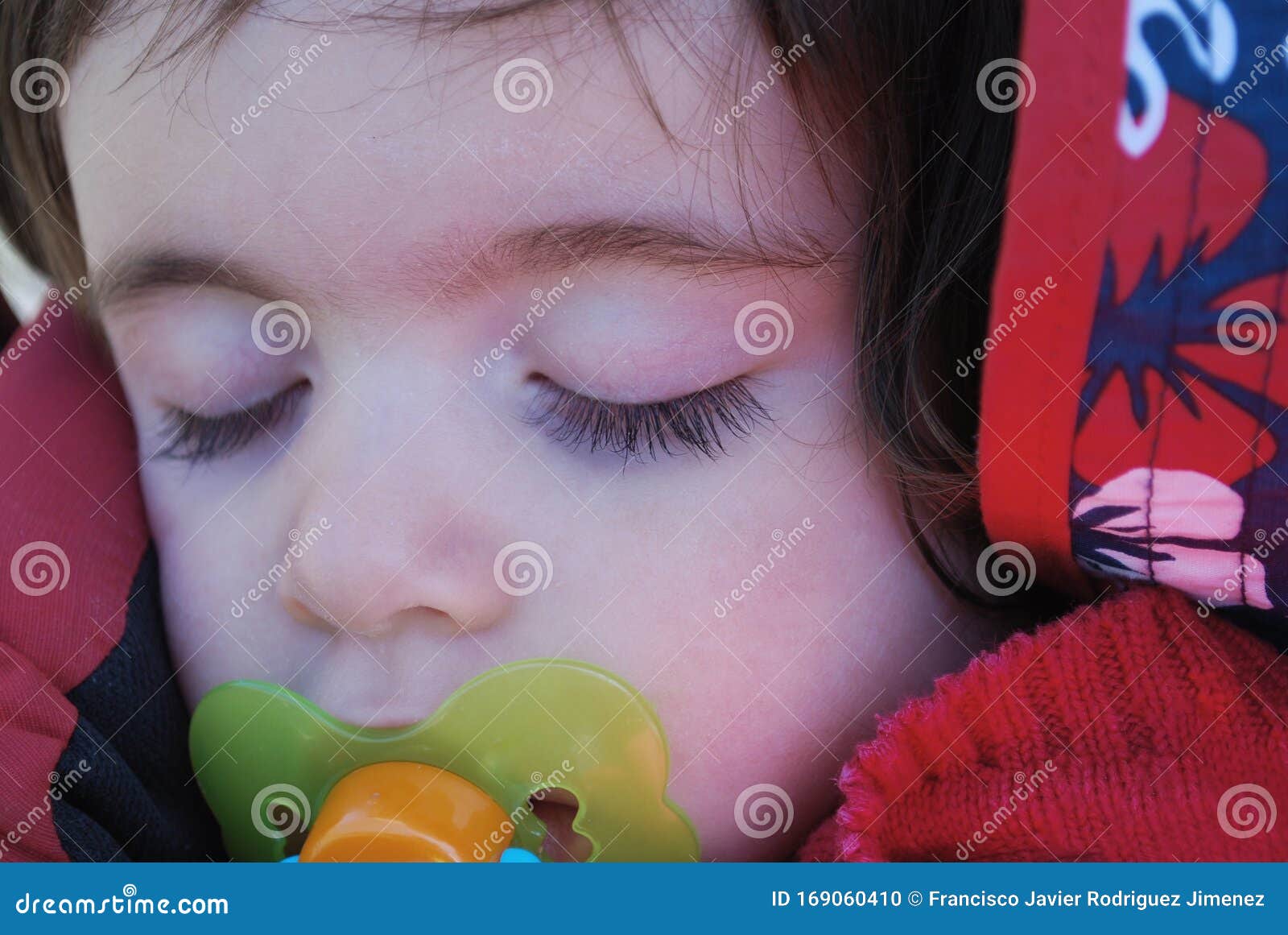Girl Sleeping in a Backpack with a Pacifier Stock Photo - Image of ...