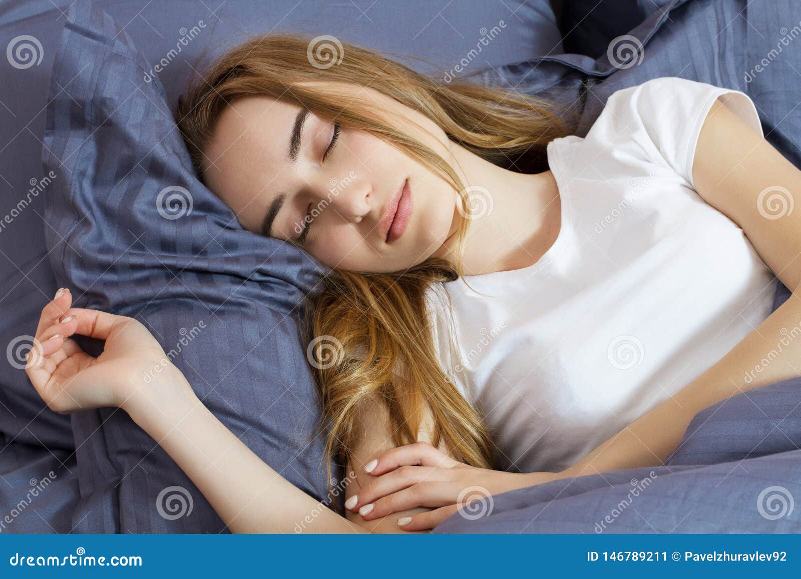 Girl is Sleeping in a Bed at Home Top View. Sleeping Stock Image ...