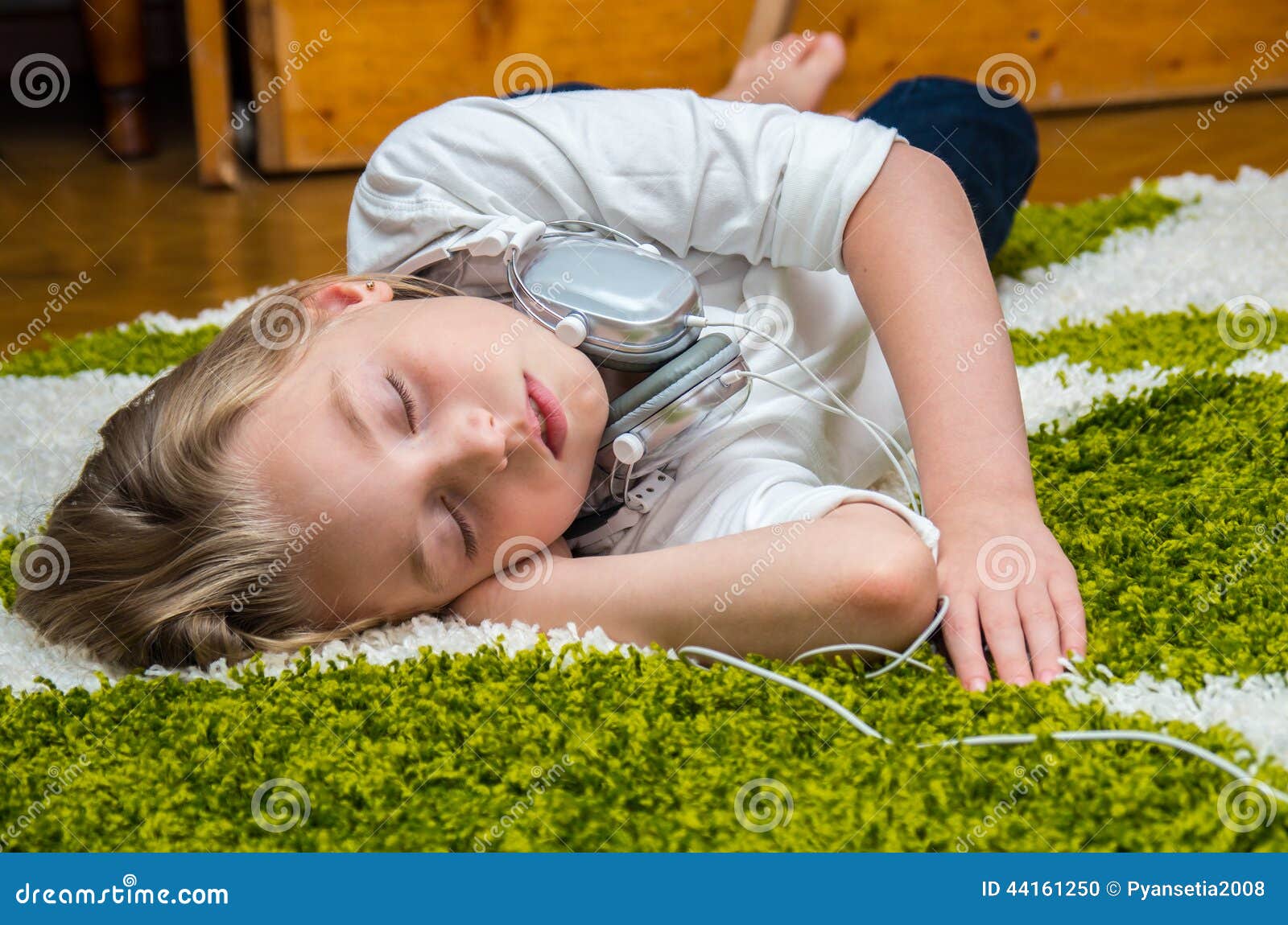 Girl Sleeping on the Carpet . Stock Photo - Image of headphone, sound ...