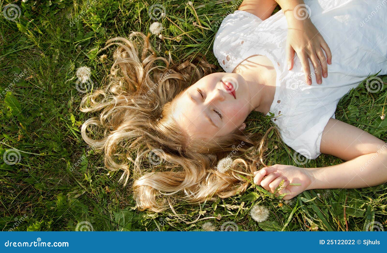 Girl Sleeping in a Field of Grass Stock Photo - Image of park, happy ...