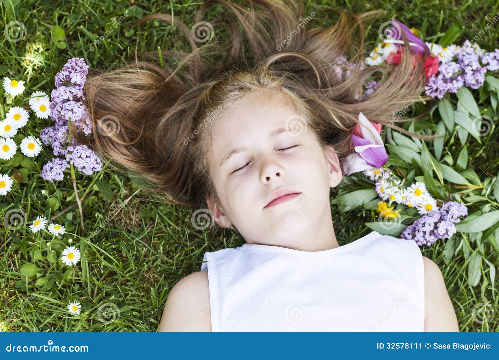 Girl sleeping in the grass stock image. Image of magnolia - 32578111