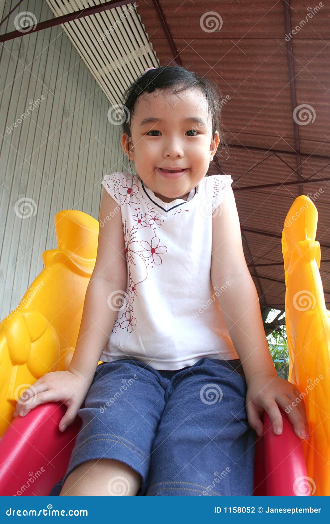 Girl on slide stock photo. Image of youth, expression - 1158052