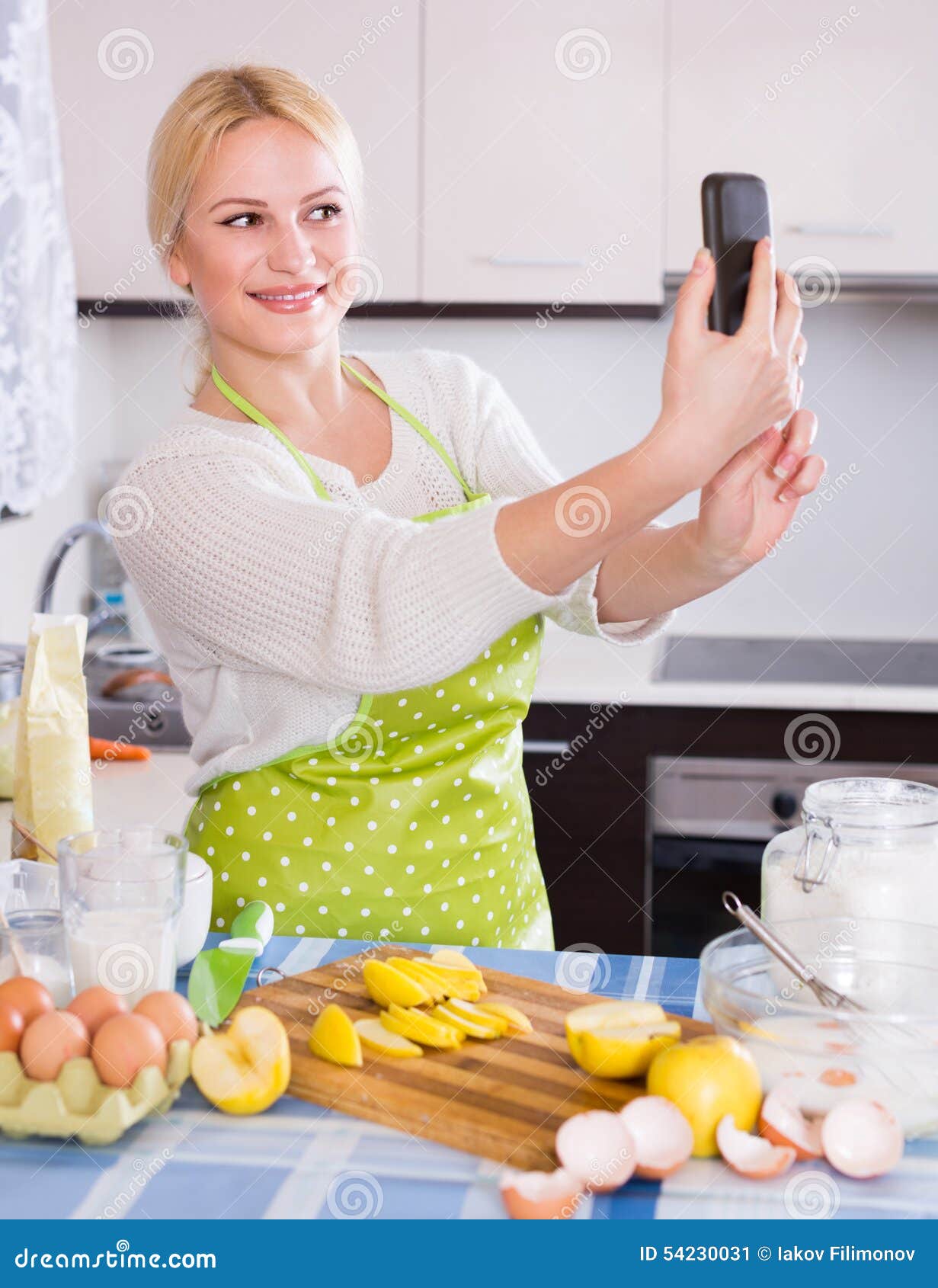 Girl with Smartphone at Kitchen Stock Image - Image of cook, blond ...