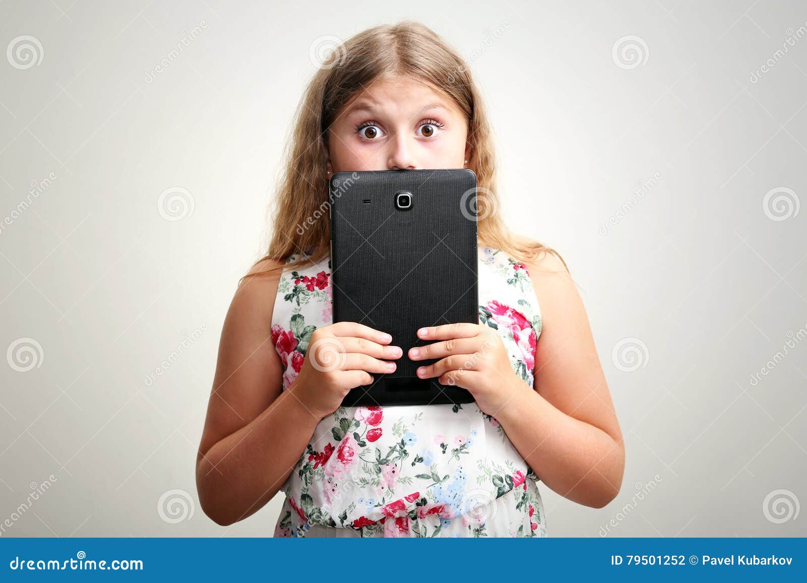 Girl Smiling and Surprised with Tablet Computer Stock Photo - Image of ...
