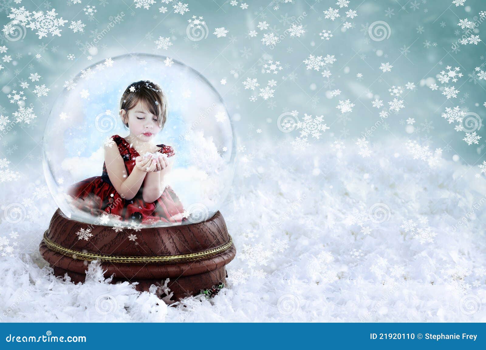 Hand Holding Snow Globe