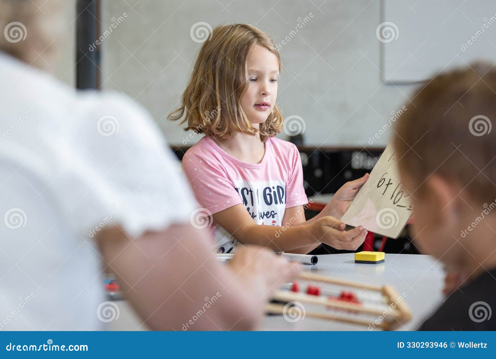 A Girl is Solving a Math Problem on a White Board Stock Photo - Image ...