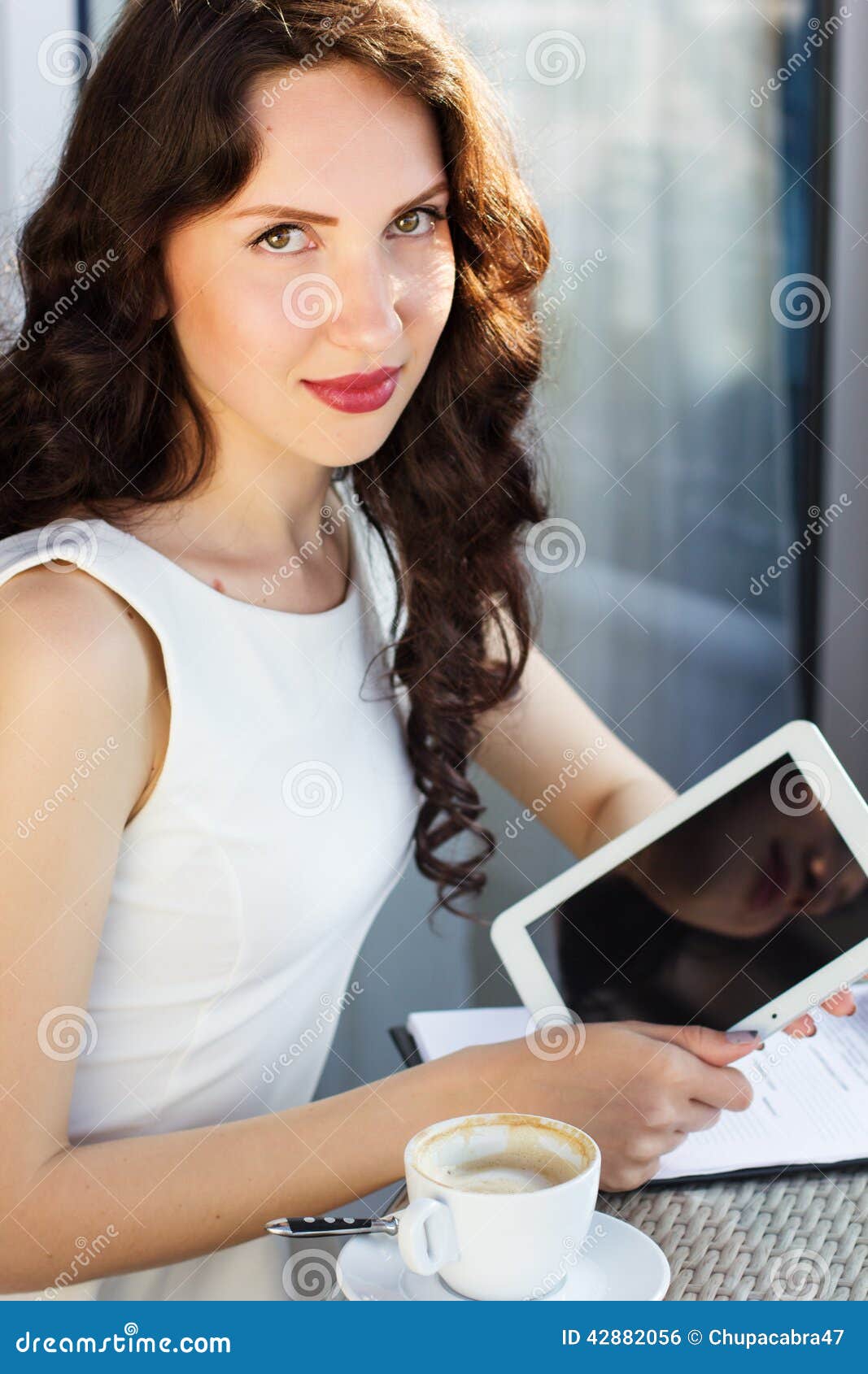 Girl Spending Time in a Cafe Using Digital Tablet Stock Photo - Image ...