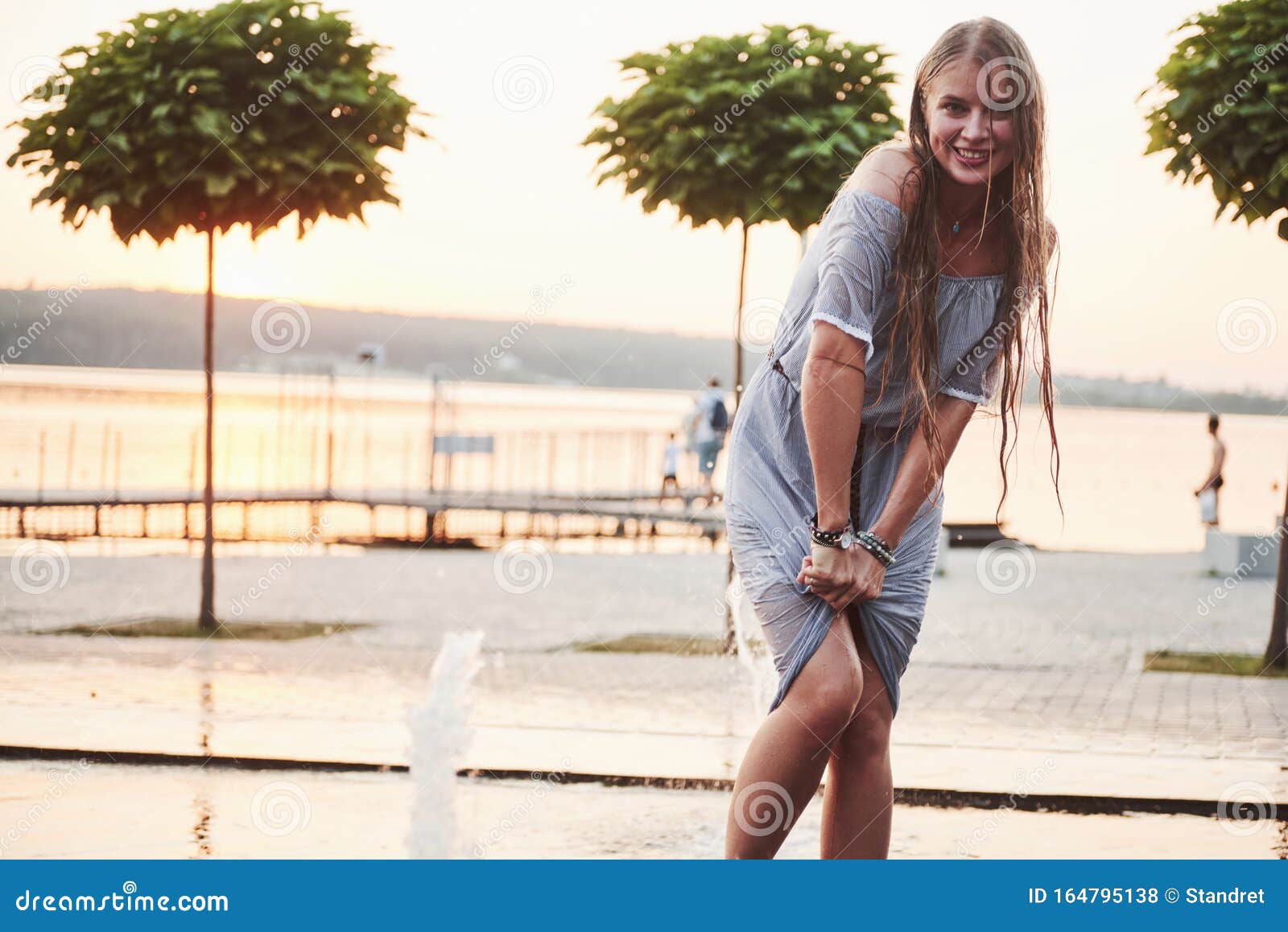 The Girl in the Splash of Water in the Fountain. Stock Photo - Image of ...