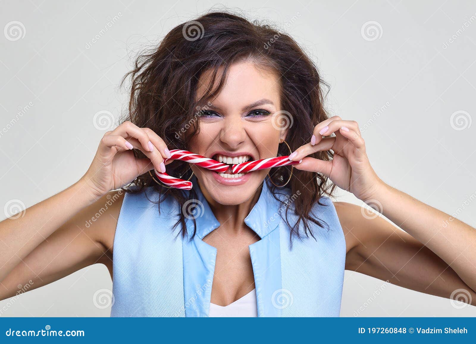 The Girl Split the Candy with Her Teeth Stock Photo - Image of split ...