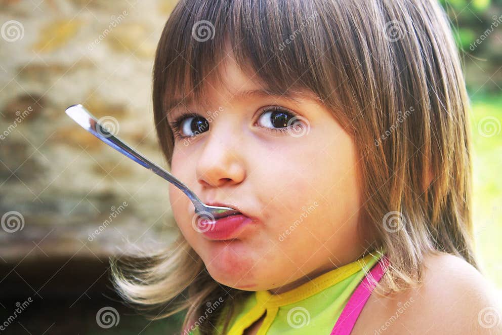 Girl with spoon stock image. Image of portrait, snack - 12277303