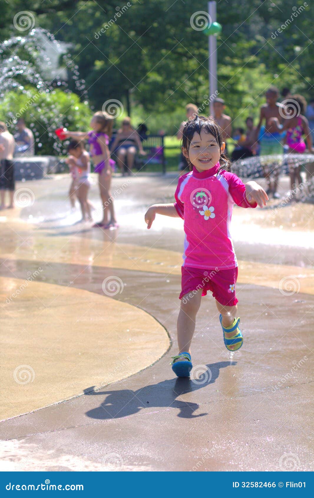 Girl in spray pad stock photo. Image of energy, happy - 32582466