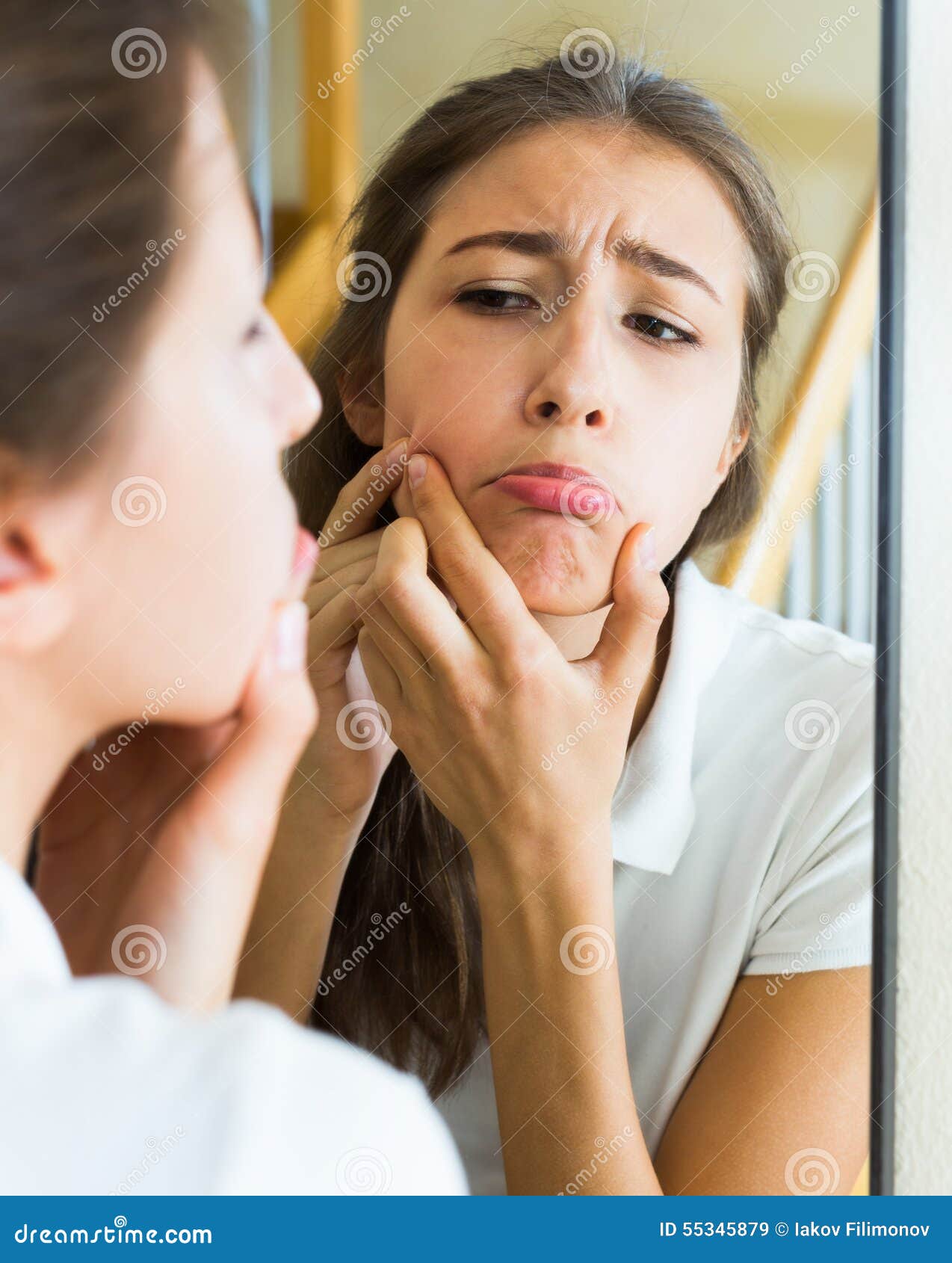 Girl squeezing pimple stock image. Image of facial, inside - 55345879