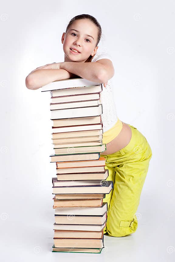 Girl with Stack of Books stock image. Image of teenager - 14045023
