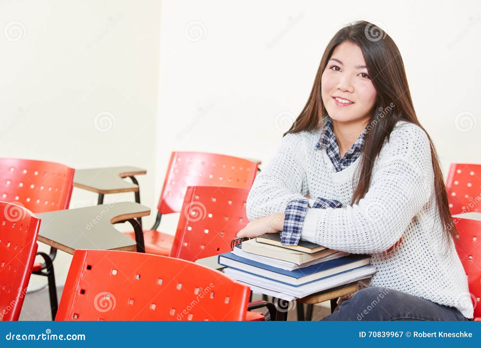 Girl with a Stack of Books in Her Classroom Stock Image - Image of ...