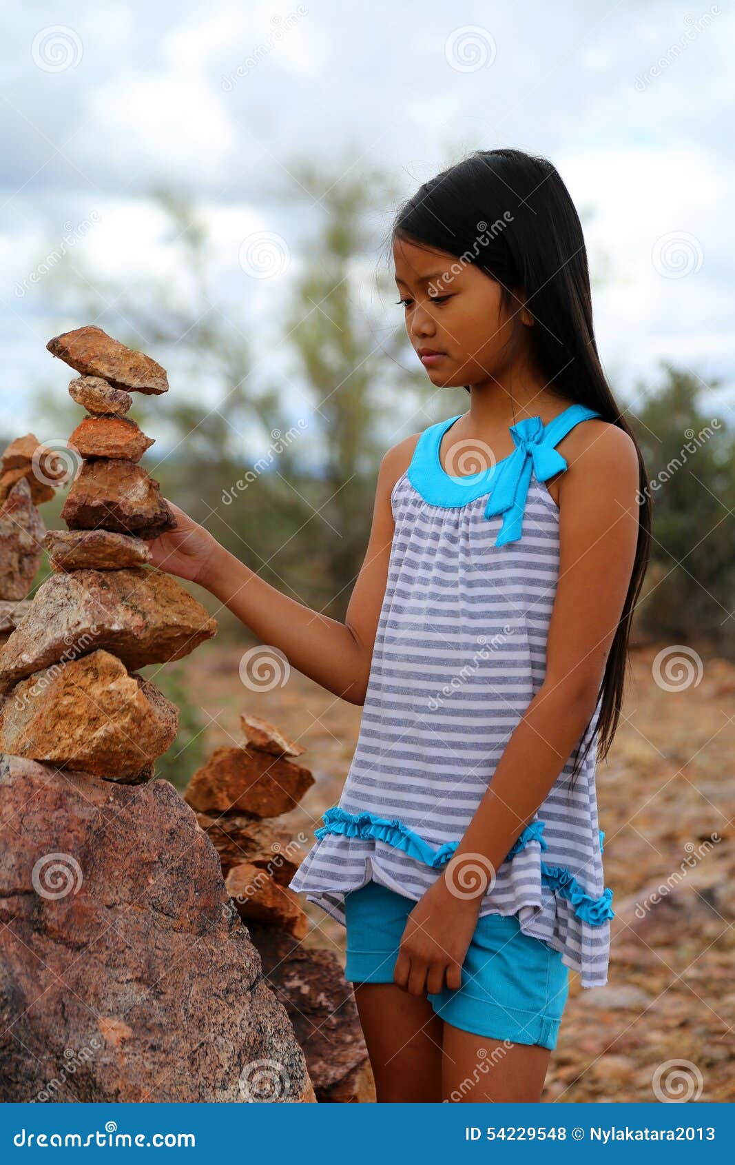 Girl stacking rocks stock photo. Image of hills, arizona - 54229548