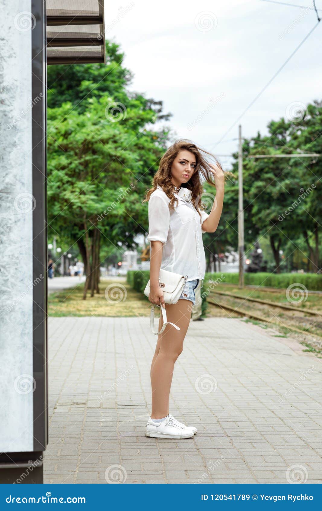 Girl is Standing at the Bus Stop Stock Image - Image of road, sitting ...