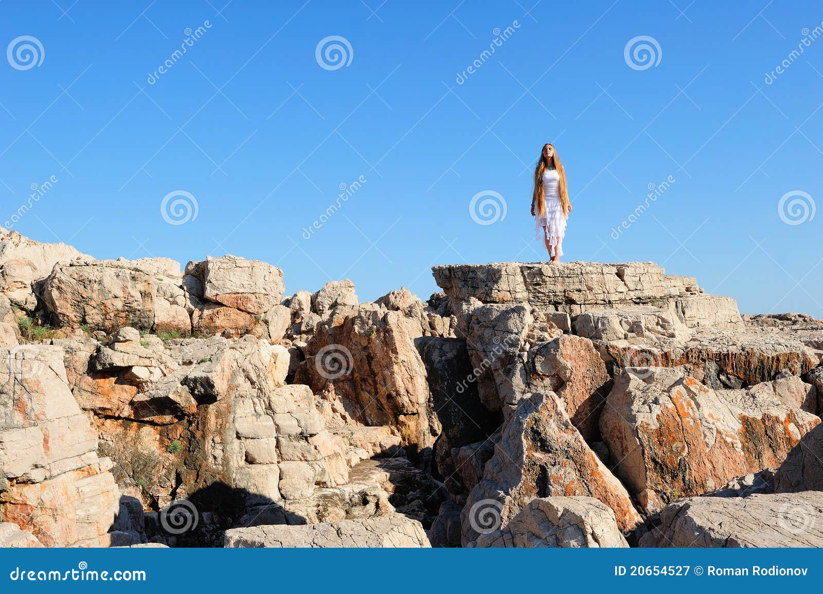 Girl standing on a cliff stock image. Image of dress - 20654527