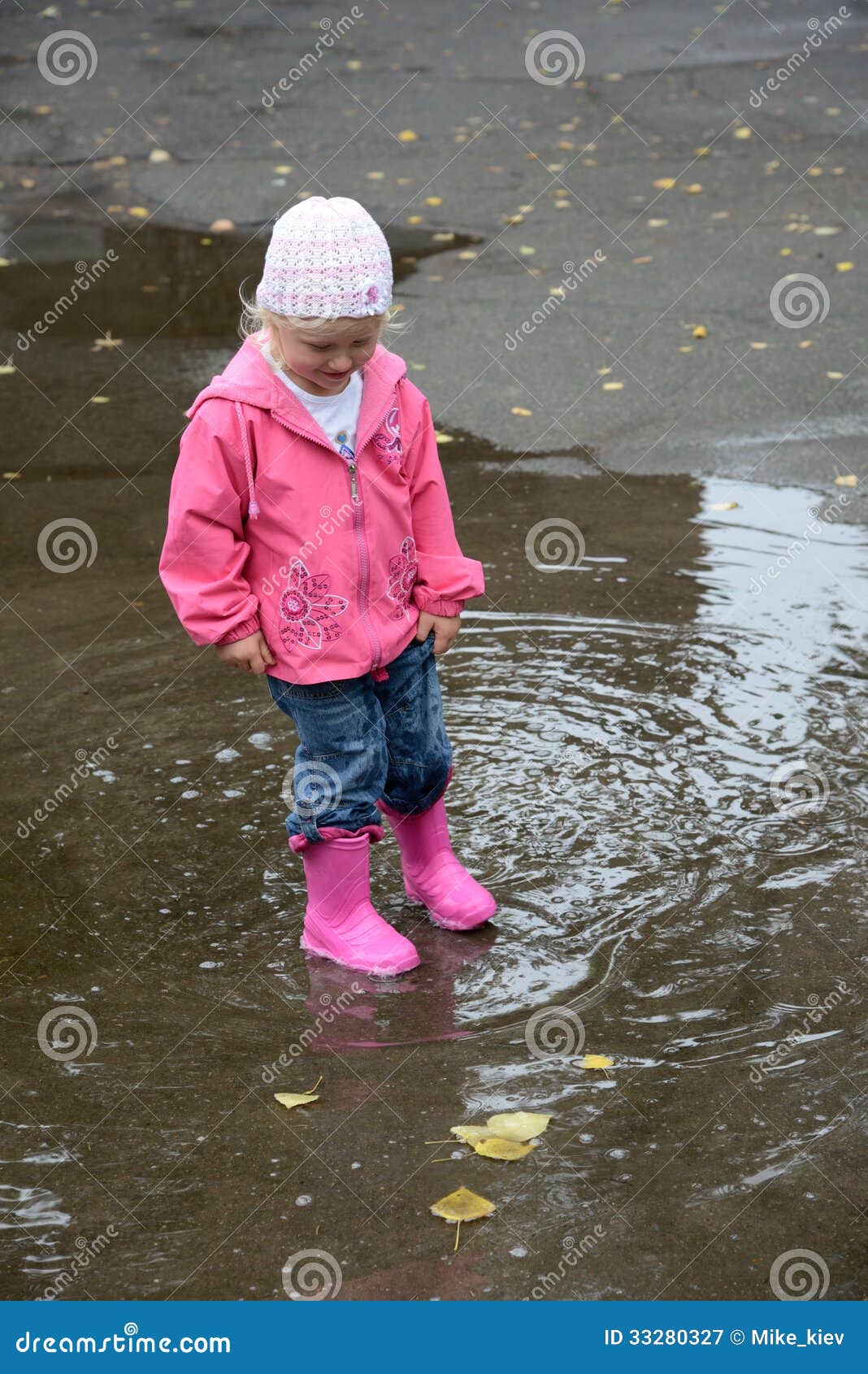 Girl standing in puddles stock image. Image of rubber - 33280327