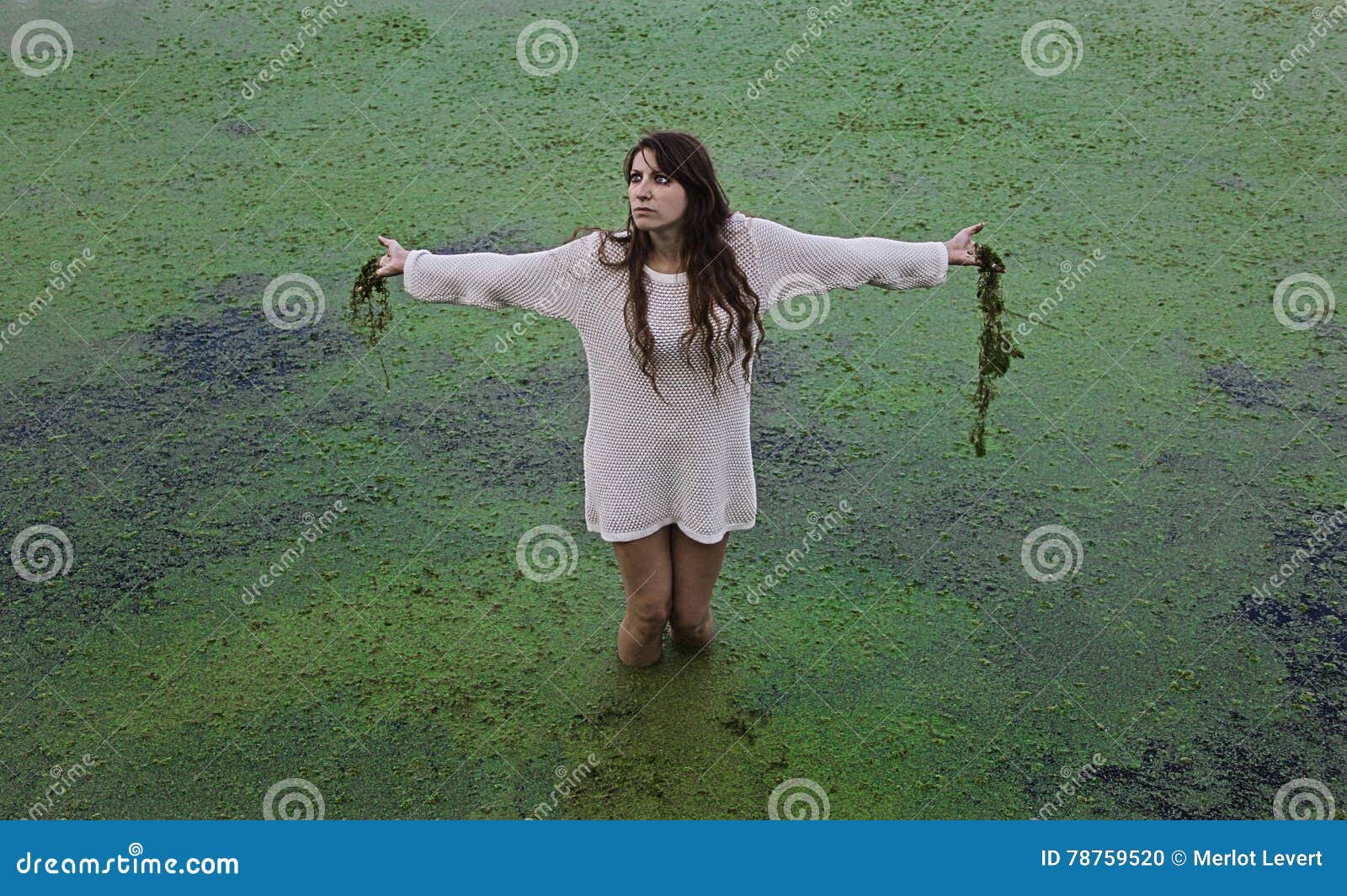 A girl standing in a swamp stock photo. Image of standing - 78759520