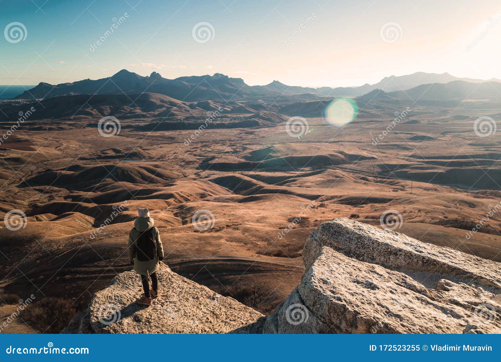Girl Stands on the Edge of a Cliff Overlooking the Valley Stock Image ...