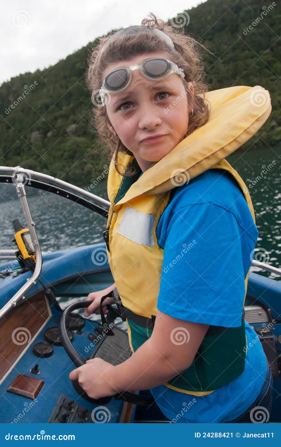 Girl steering boat stock image. Image of expression, natural - 24288421