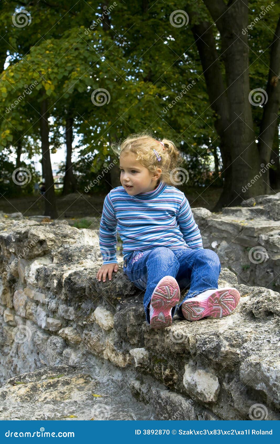Girl on stone wall stock photo. Image of outdoors, outdoor - 3892870