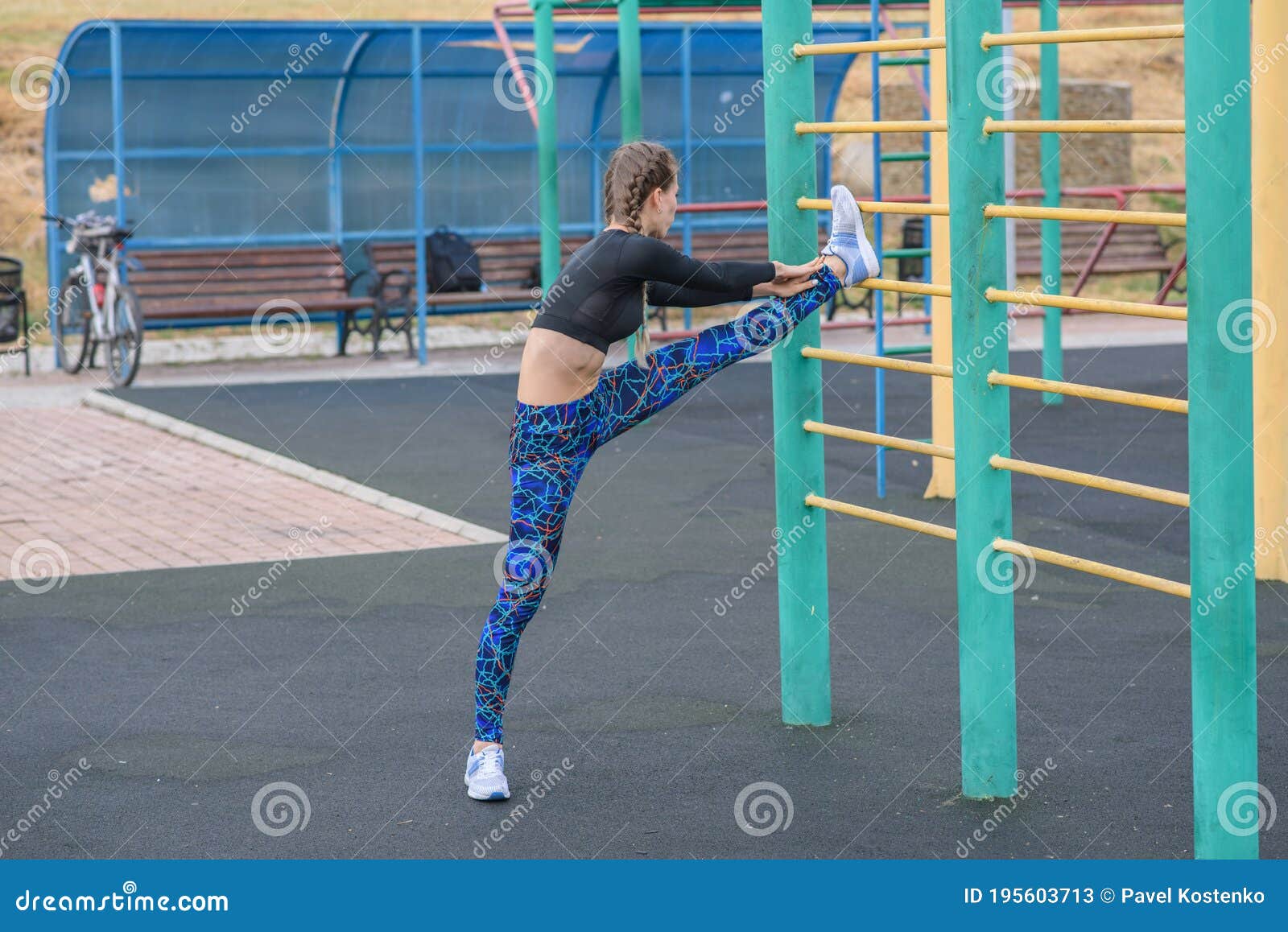 Girl Stretches on the Playground. Stock Image - Image of outdoors ...