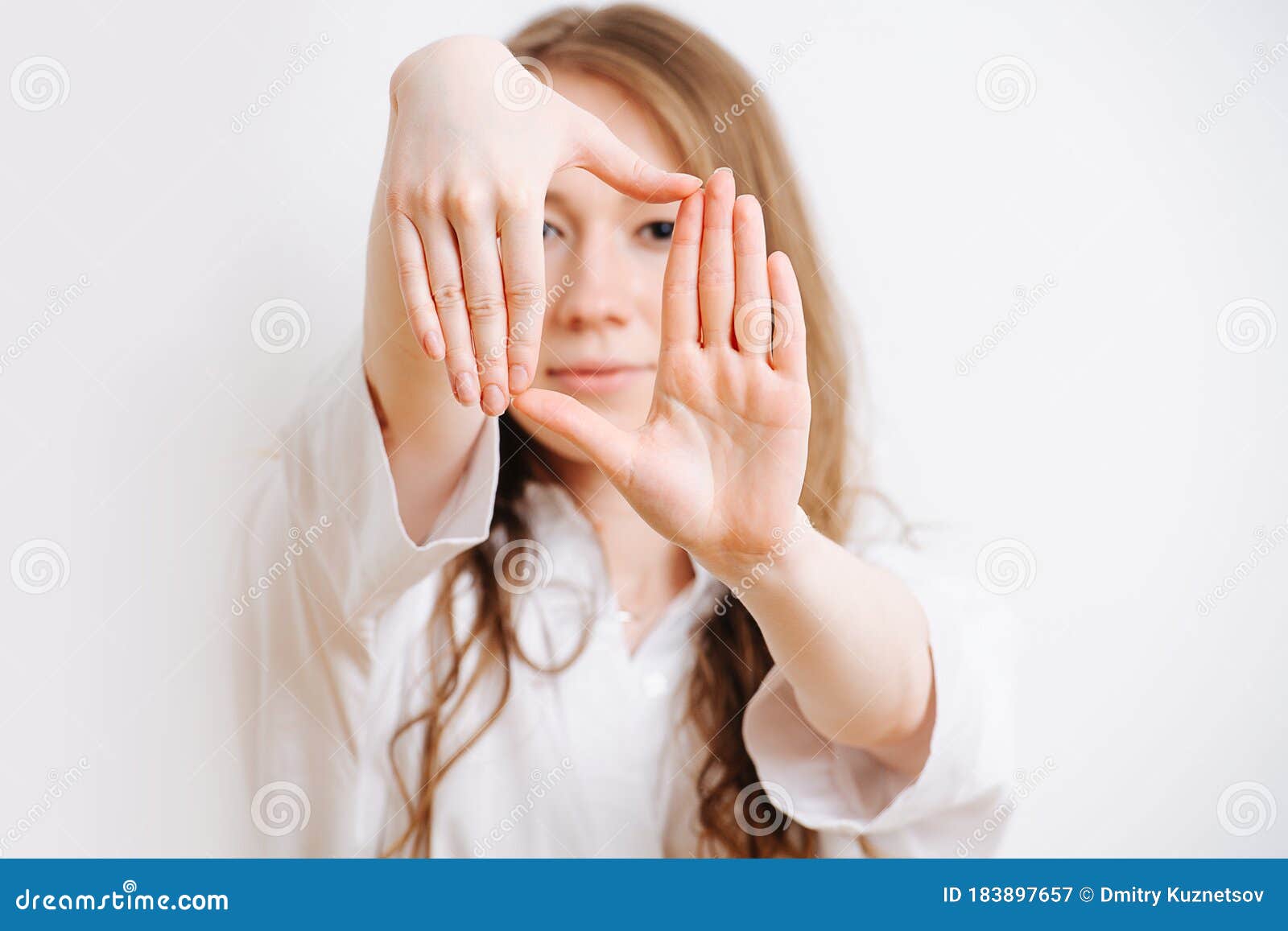 Girl Stretching Her Arms Forward, she Making Framing with Her Hands ...