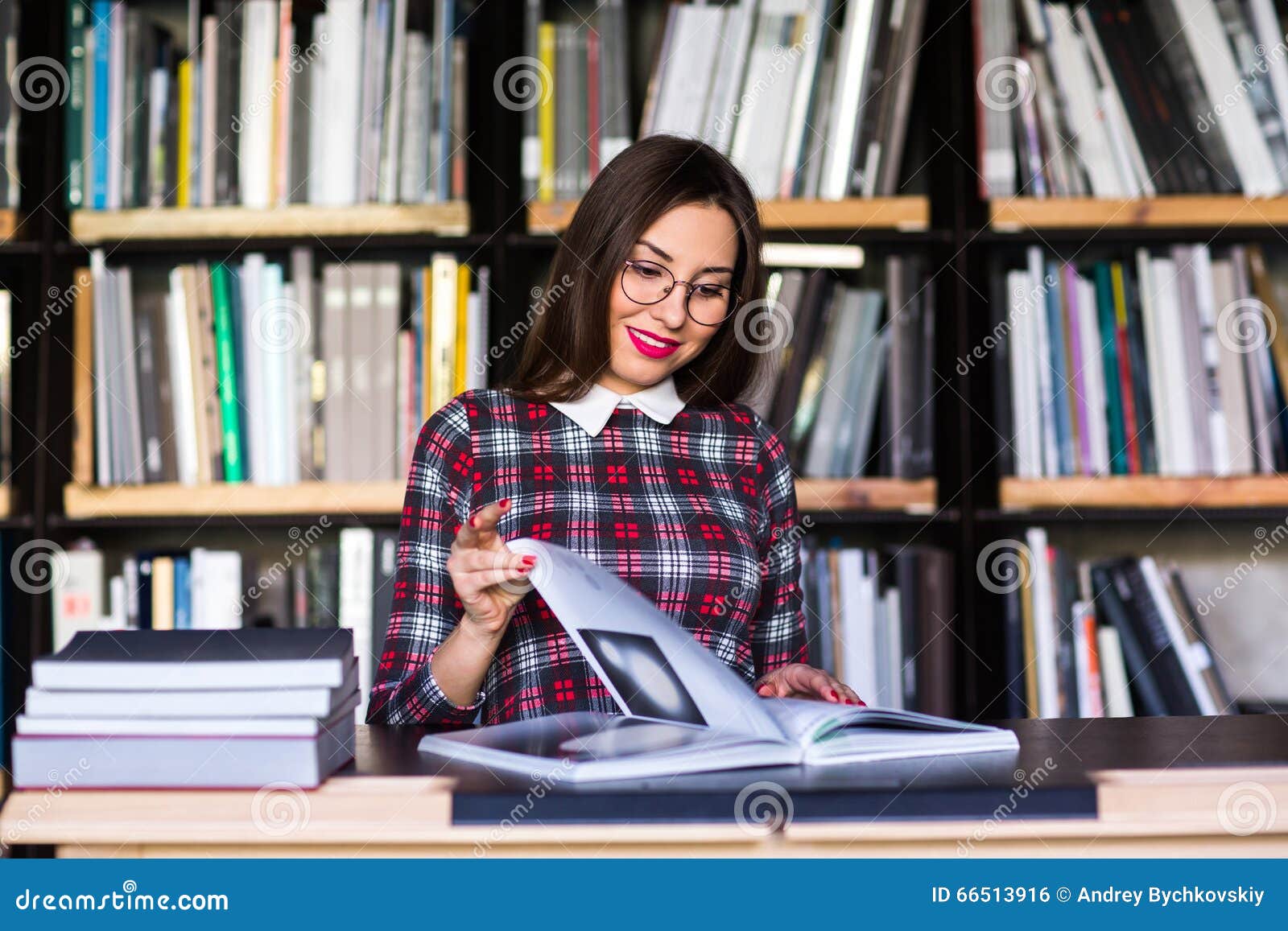 Girl Student with Glasses Reading Books in the Library Stock Photo ...