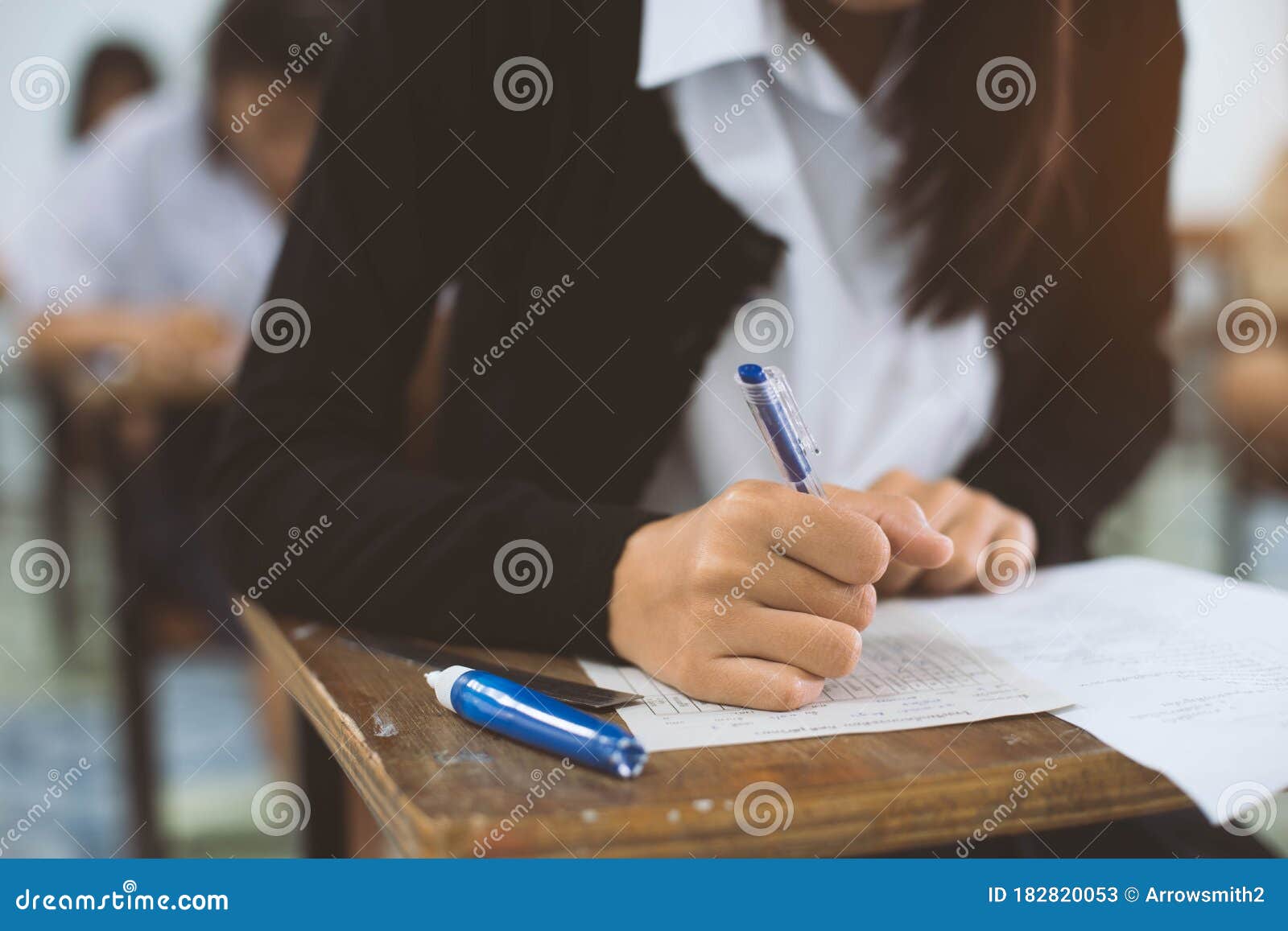 Girl Student Reading and Writing Exam with Stress in the Classroom ...