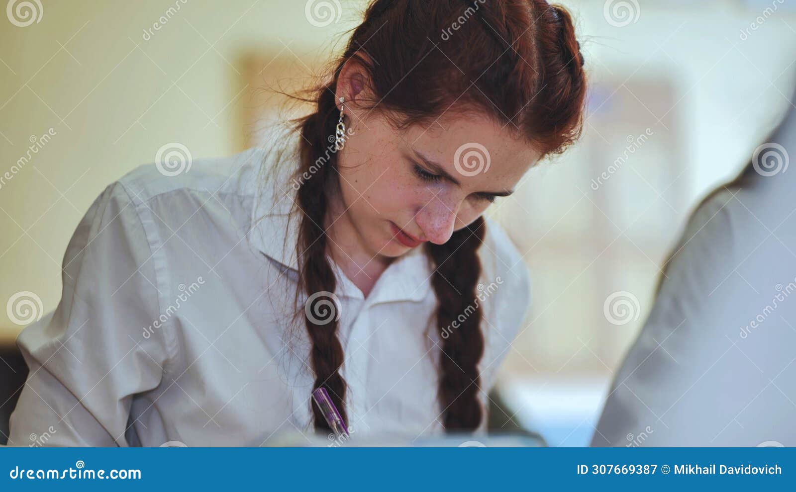A Girl Student Writes Math Formulas in a Notebook. Stock Image - Image ...