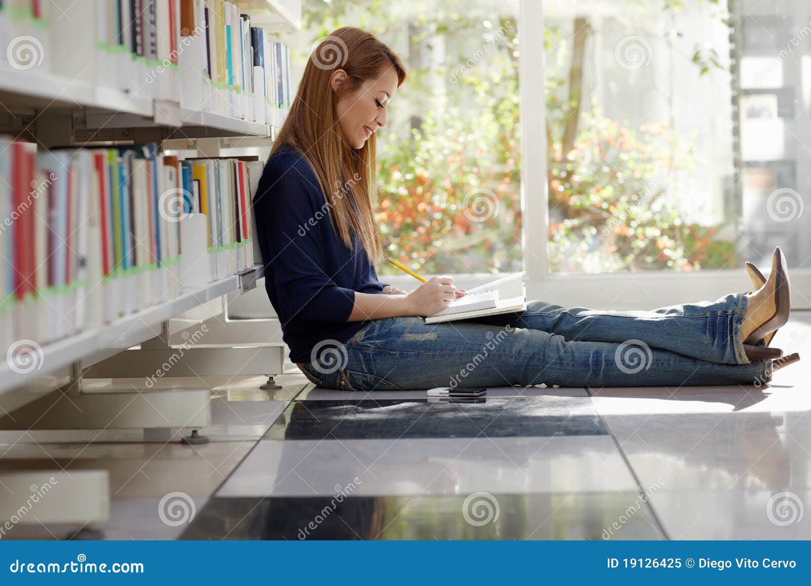 Girl Studying on Floor in Library Stock Image - Image of book, hair ...