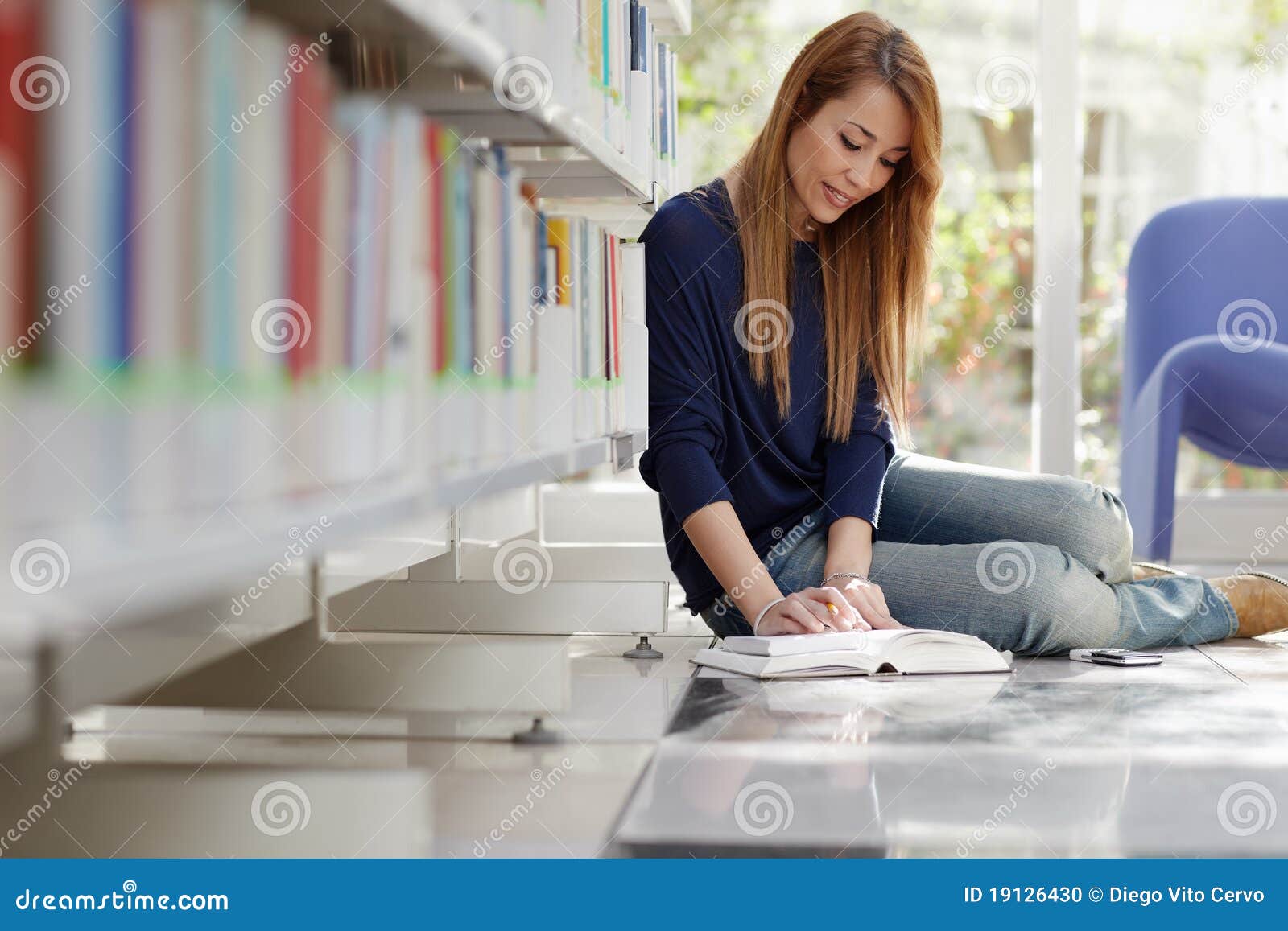 Girl Studying on Floor in Library Stock Photo - Image of full, hair ...