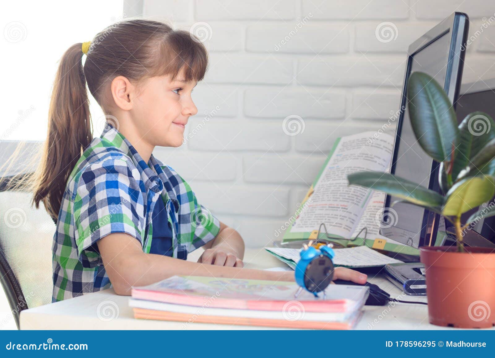 The Girl is Studying Remotely at Home, Using Online Learning Stock ...