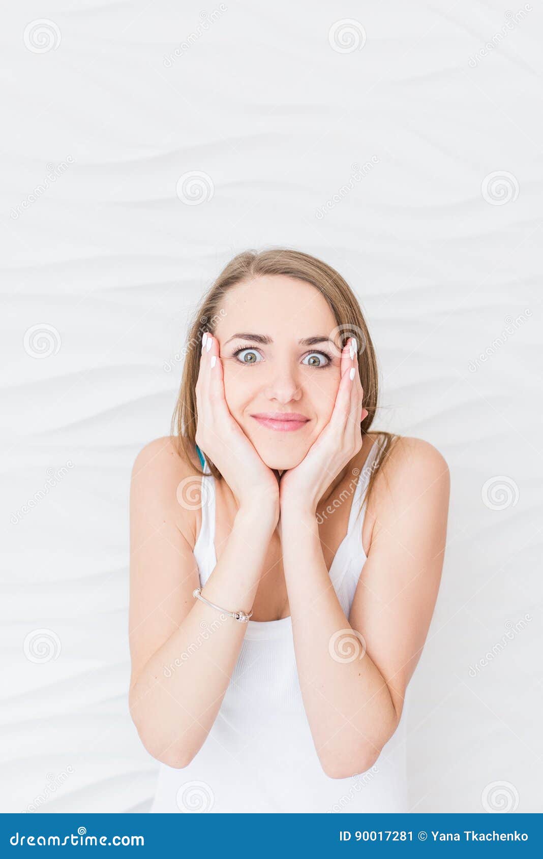 A Girl with Surprised Expression while Touching Her Face with Her Hands ...