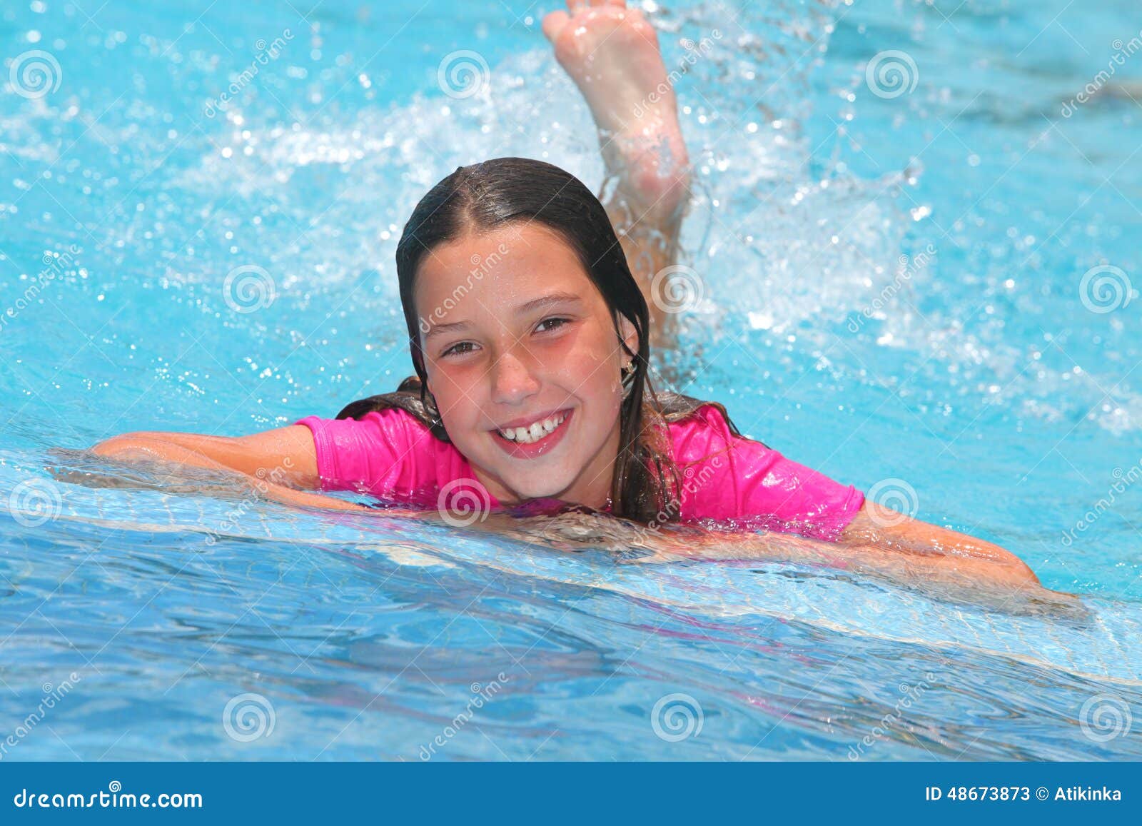 Girl in a swimming pool stock image. Image of swimming - 48673873