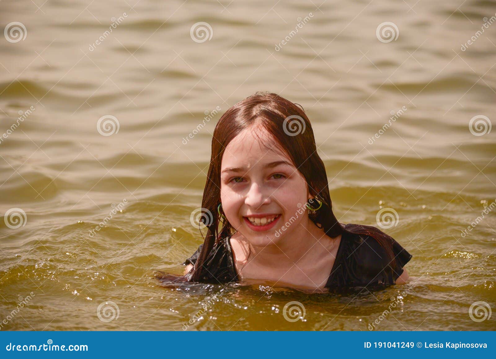 A Girl Swims In The River Close Up Of Young Beautiful Girl In Water