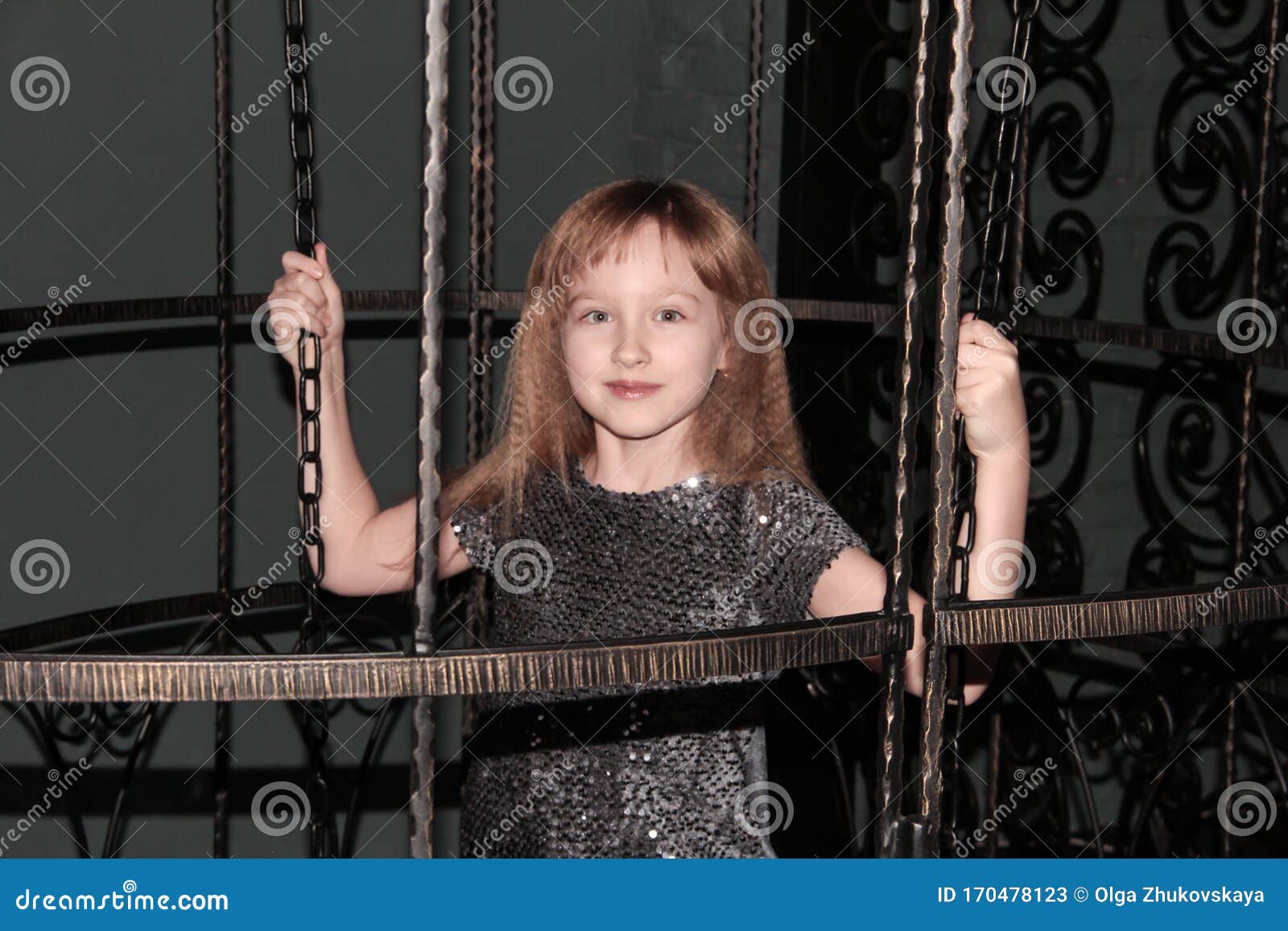 Girl on a swing in a cage stock image. Image of portrait - 170478123
