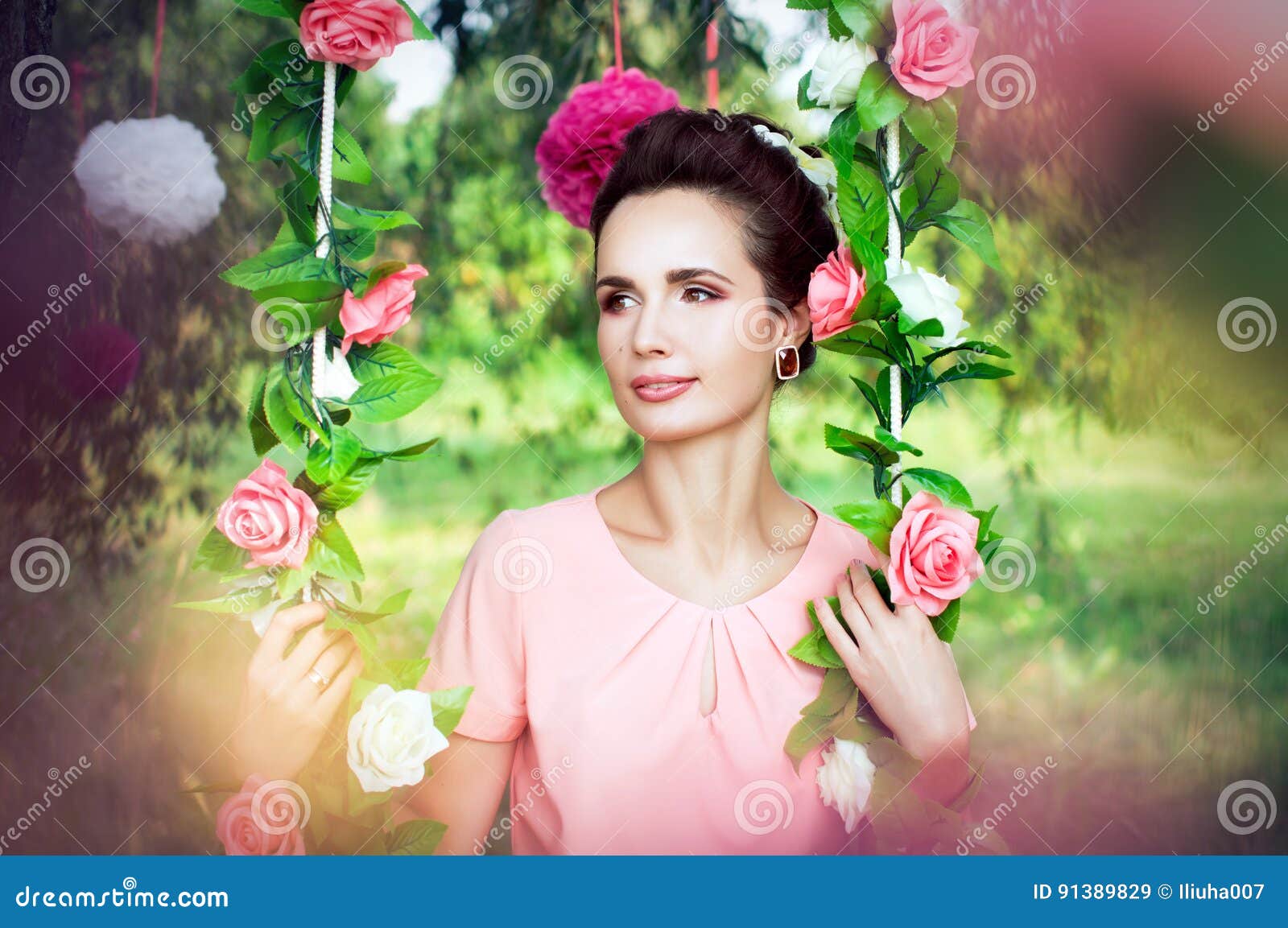 Girl on a swing in flowers stock image. Image of glamour - 91389829