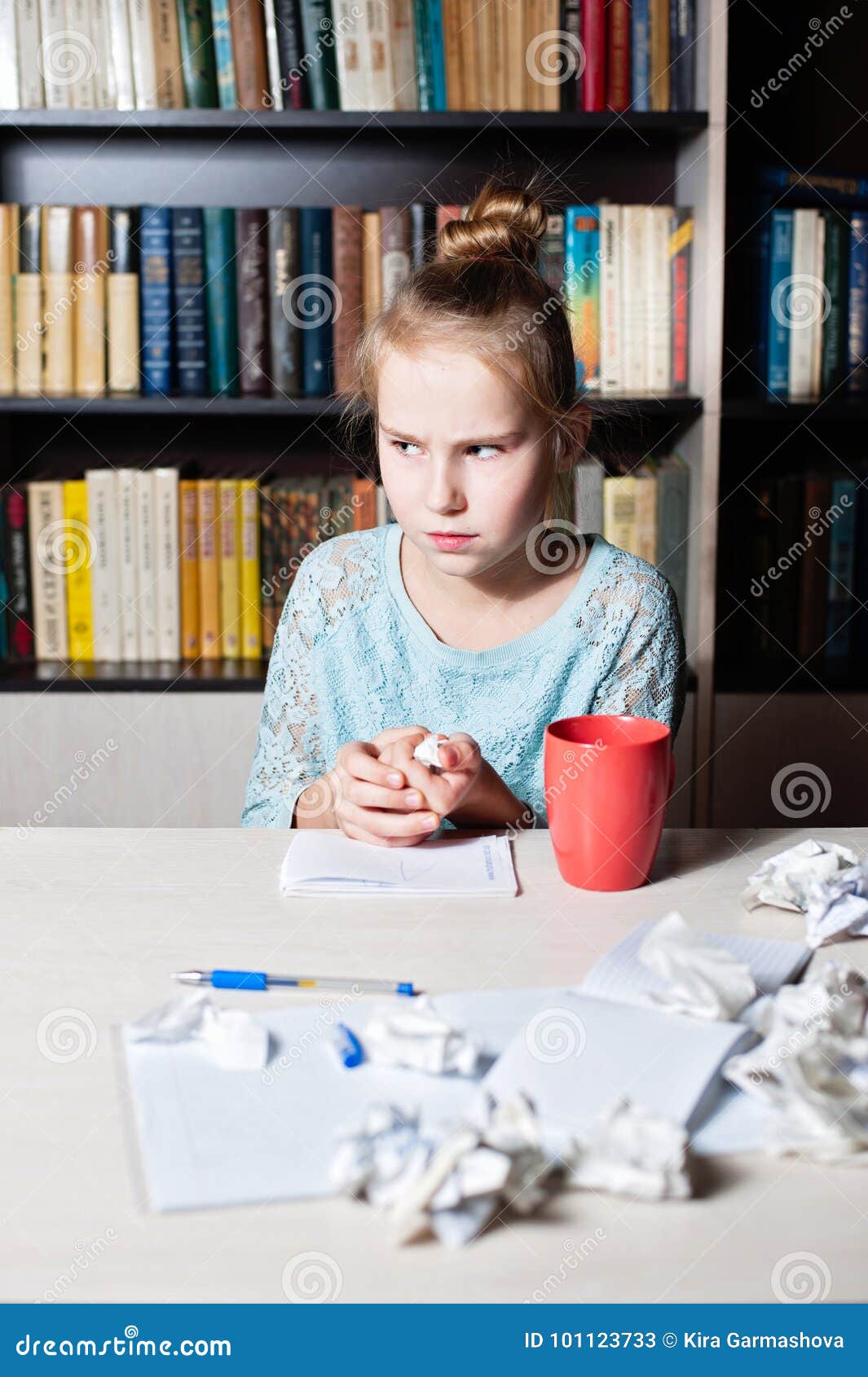 Girl at the Table, in Hands Crumpling a Piece of Paper Stock Image ...