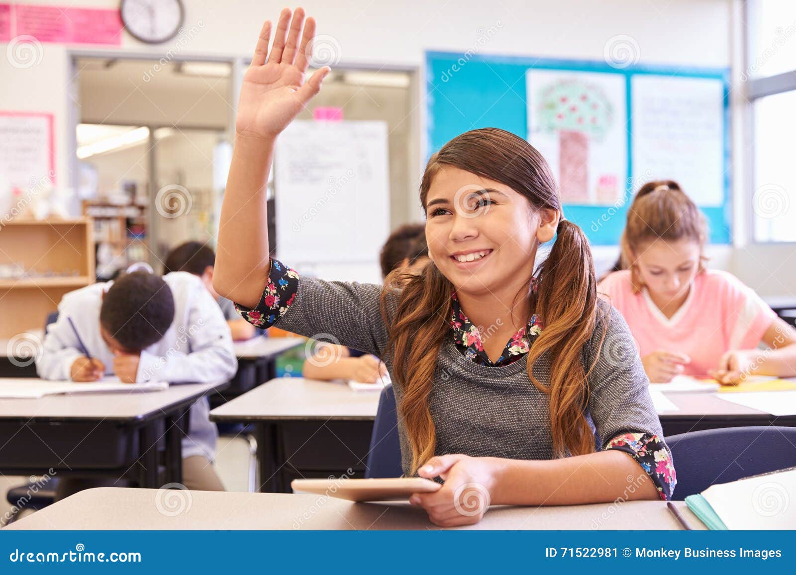 Girl with Tablet Raising Hand in Elementary School Class Stock Image ...